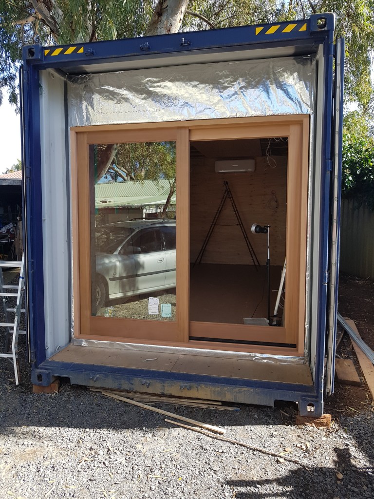 Meranti Sliding door in cargohold – THE WINDOW MAN